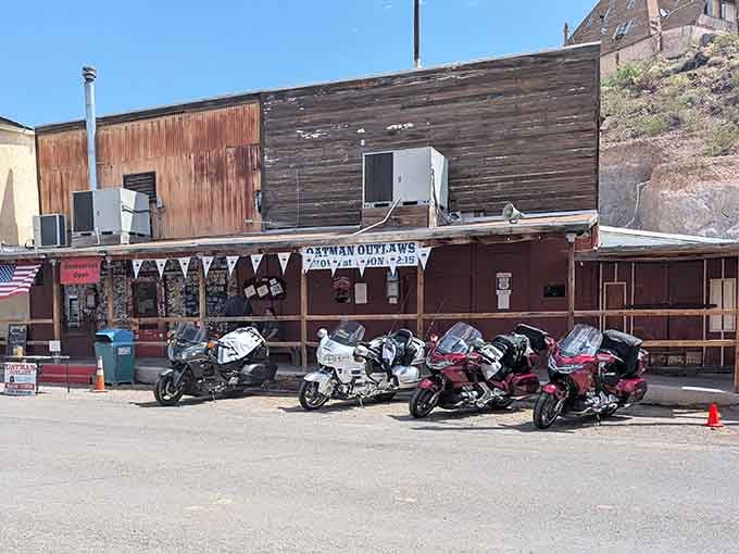 Motorcycles line up outside the Oatman Outlaws like modern-day horses hitched to the saloon rail, just shinier and louder.