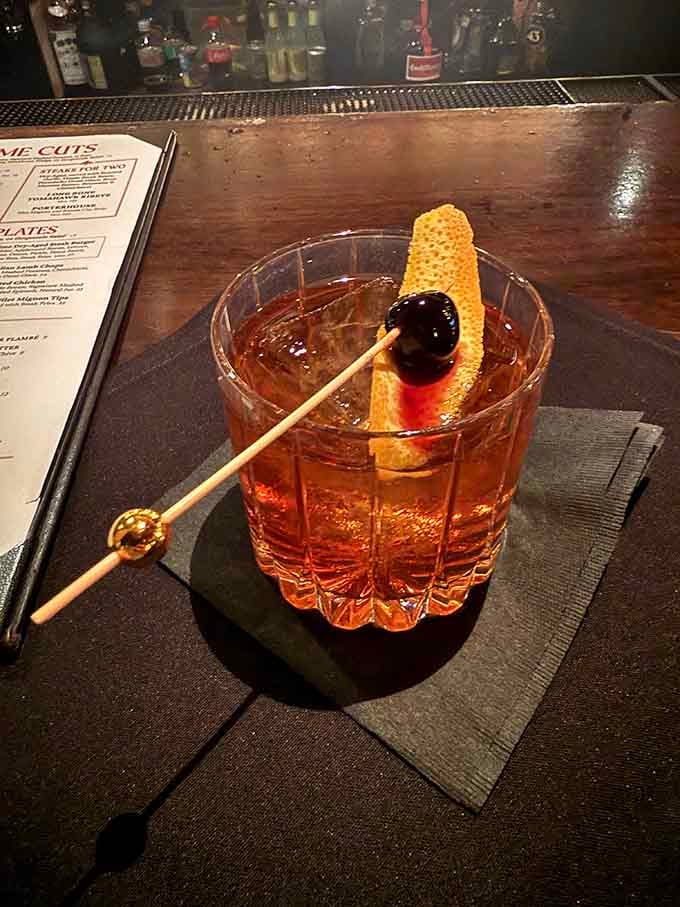 That old fashioned with its honeycomb garnish shows the bar takes cocktails as seriously as the kitchen takes steaks.