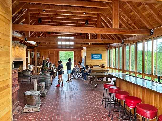 The Brewhouse interior features exposed beams and vintage charm, where traditional brewing methods created liquid history one batch at a time.
