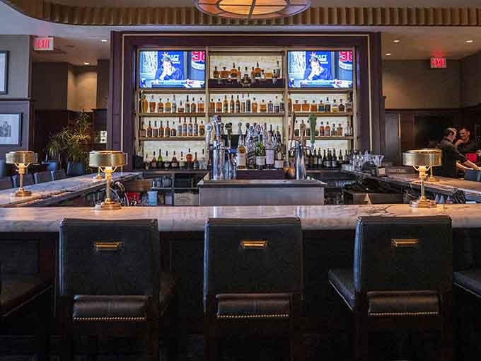 The sleek bar area beckons with top-shelf spirits and TVs, perfect for pre-dinner cocktails or nightcaps.