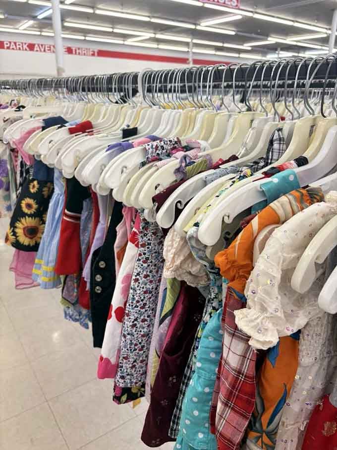 Tiny dresses in every color imaginable hang like a rainbow of possibilities for the little ones.