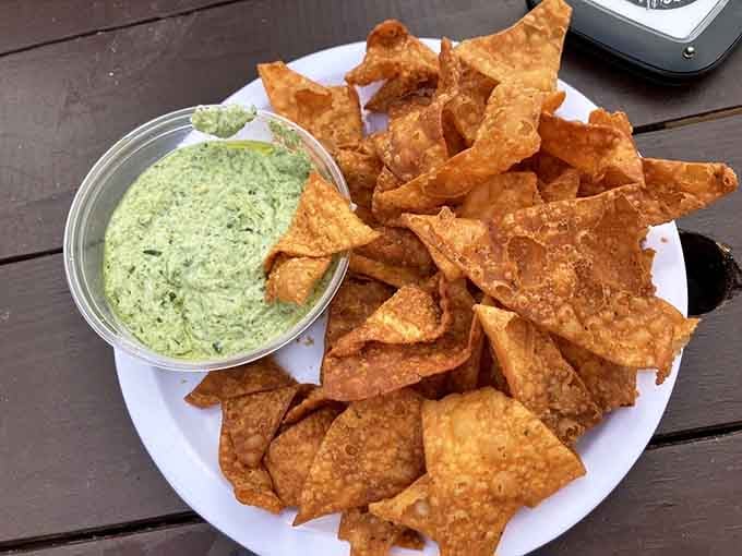 Crispy chips meet creamy spinach dip in an appetizer that'll disappear faster than your willpower.