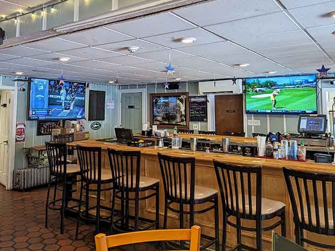 The bar area features multiple screens and comfortable seating, making it perfect for catching the game with friends.
