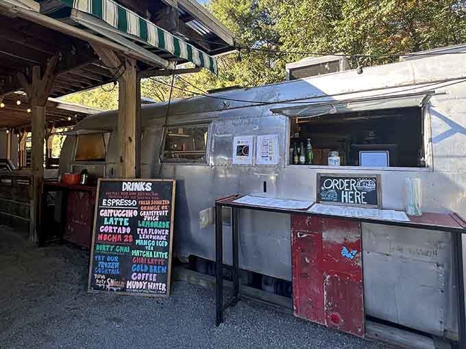 That vintage Airstream coffee truck outside means you can grab quality caffeine even when the wait gets long, genius planning.