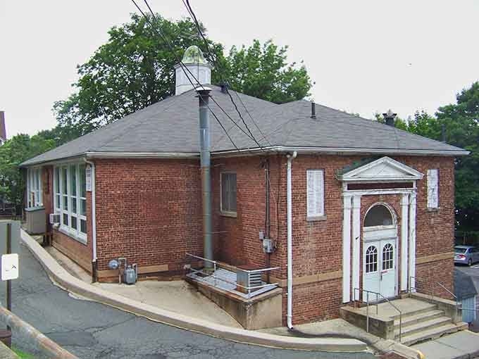 Classic brick schoolhouse architecture that makes modern buildings look like they're trying way too hard.