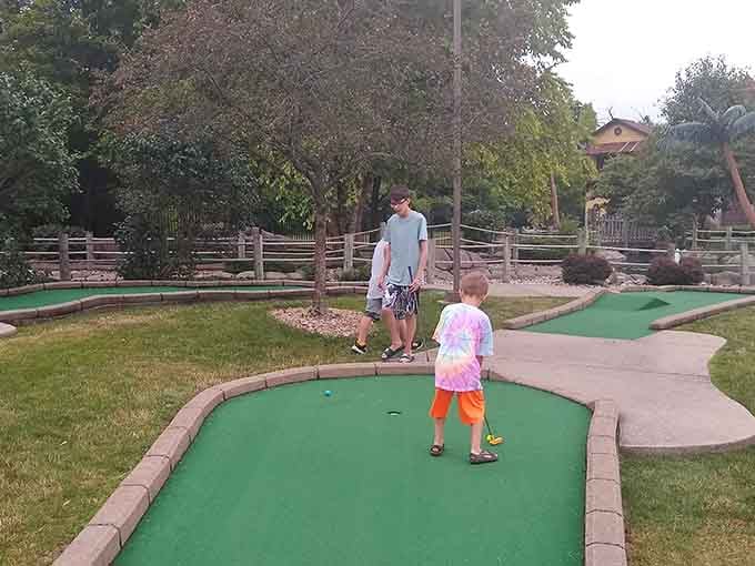 Family bonding through the ancient art of trying not to hit your ball into the water feature.