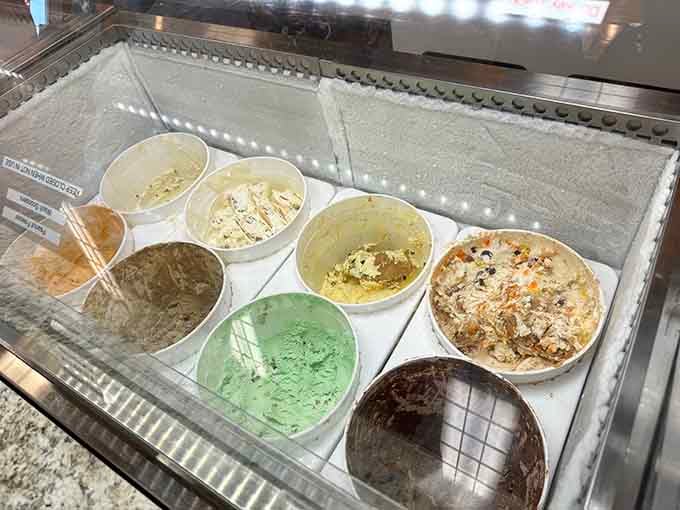 The display case reveals flavors in their natural habitat, waiting patiently for their moment of glory.