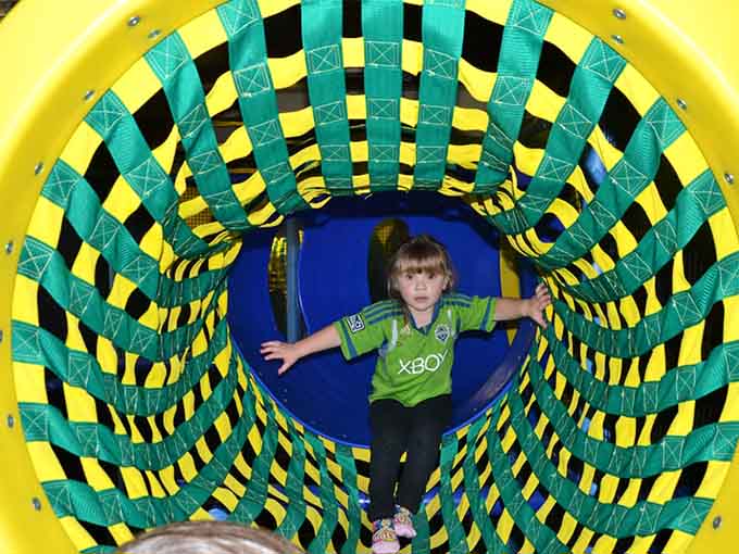 This hypnotic tunnel entrance beckons kids forward like a siren song, except nobody's getting shipwrecked, just thoroughly entertained.