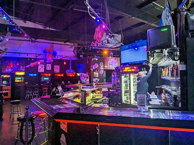 The bar glows with possibility, where ordering a drink feels as exciting as inserting that first quarter.