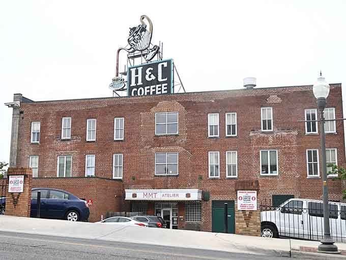 The vintage H&C Coffee sign crowns this building like a beacon for caffeine lovers citywide.
