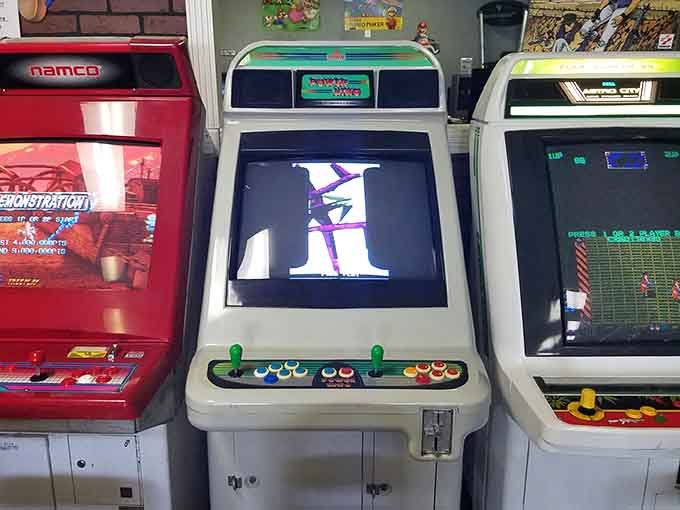 Vintage machines stand proud with their original artwork intact, proving that good design never goes out of style, just temporarily out of quarters.