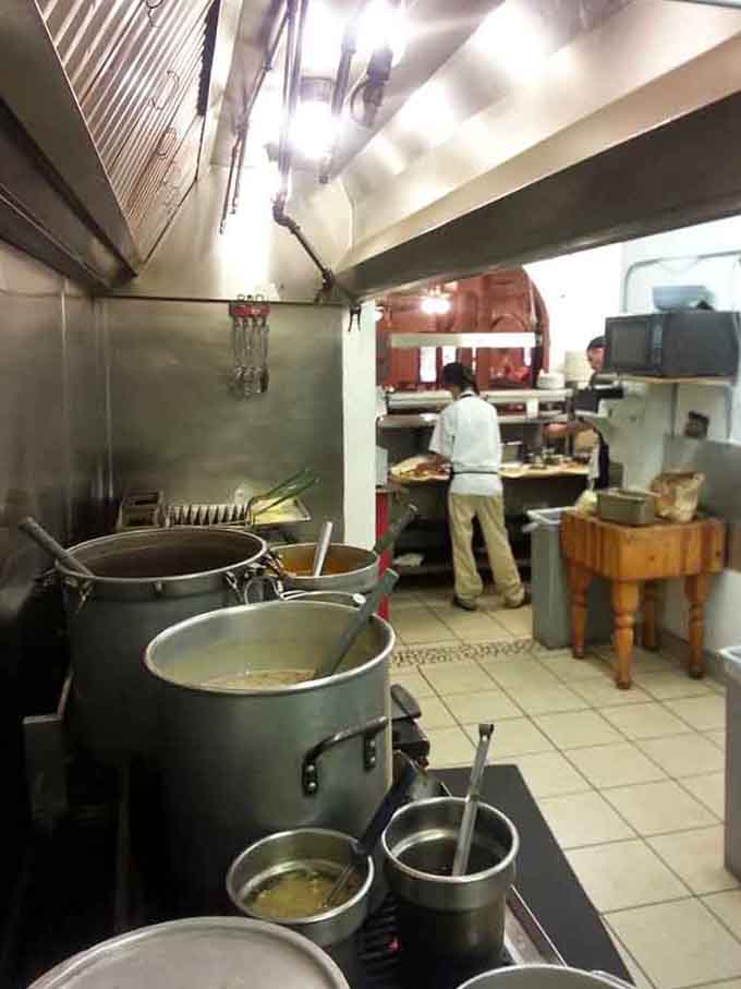 Behind the scenes, giant pots of green chile simmer away like liquid gold in Fort Knox.
