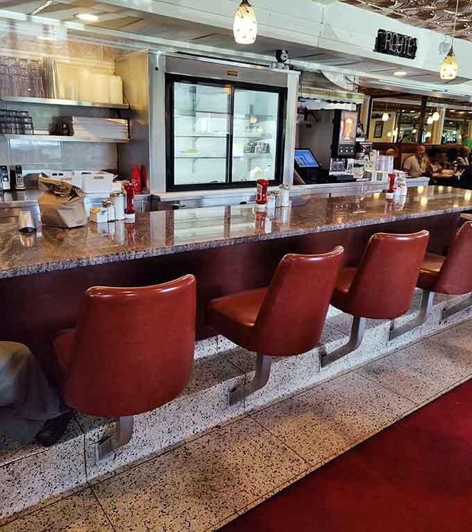 Counter seating offers front-row views of breakfast magic happening right before your hungry eyes.