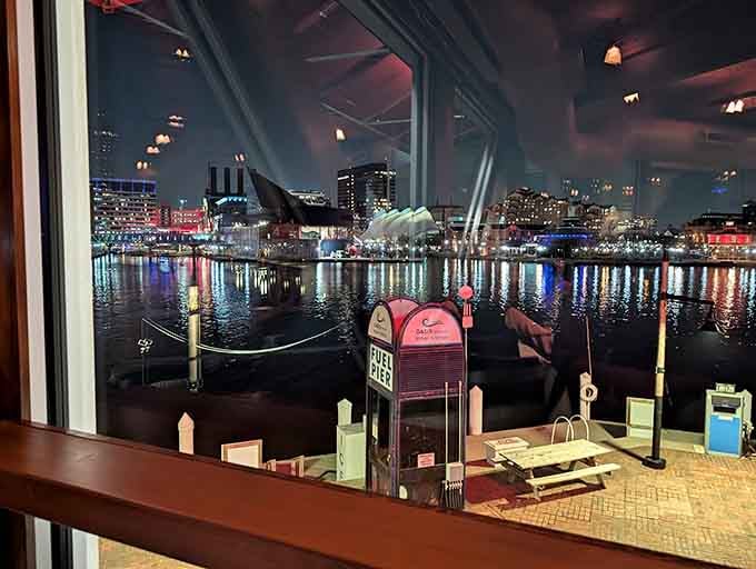 Night falls over the harbor, turning your dinner into dinner theater with twinkling city lights.