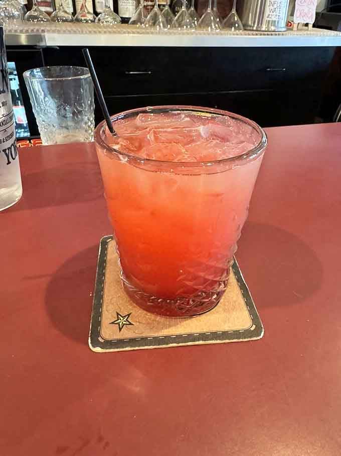 The Jasmine Paloma glows coral-pink, refreshing and floral like summer captured in a glass with citrus.