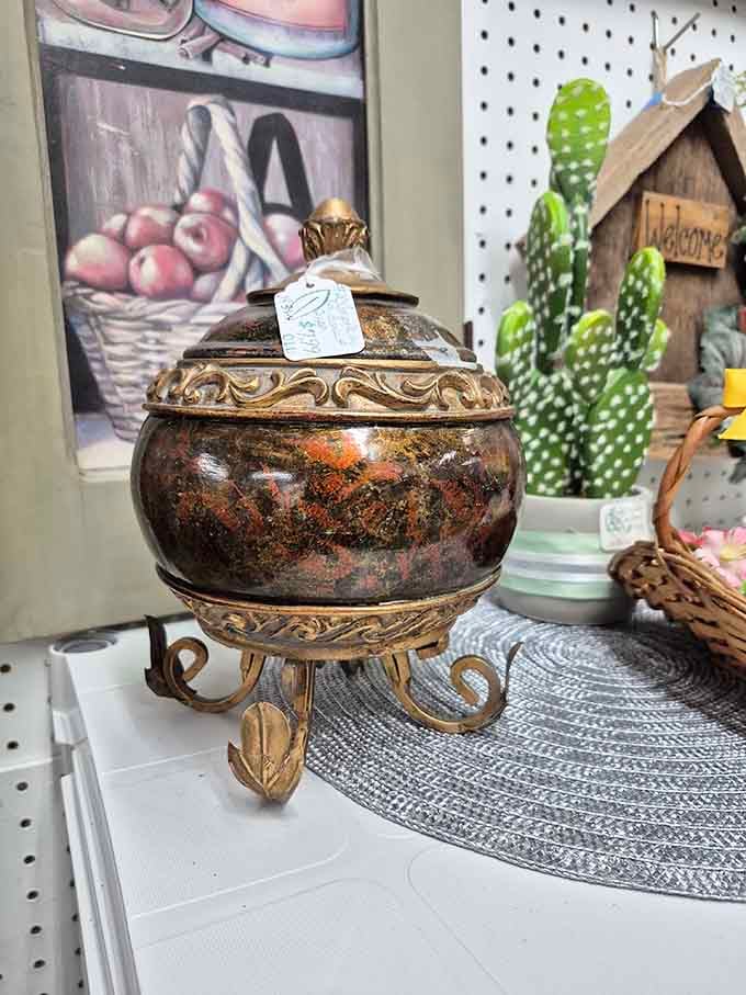 An ornate decorative vessel that looks like it could grant wishes or at least hold your spare change stylishly.
