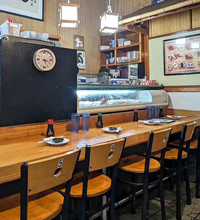 The sushi bar where skilled hands craft edible architecture that defies gravity and exceeds all reasonable expectations.