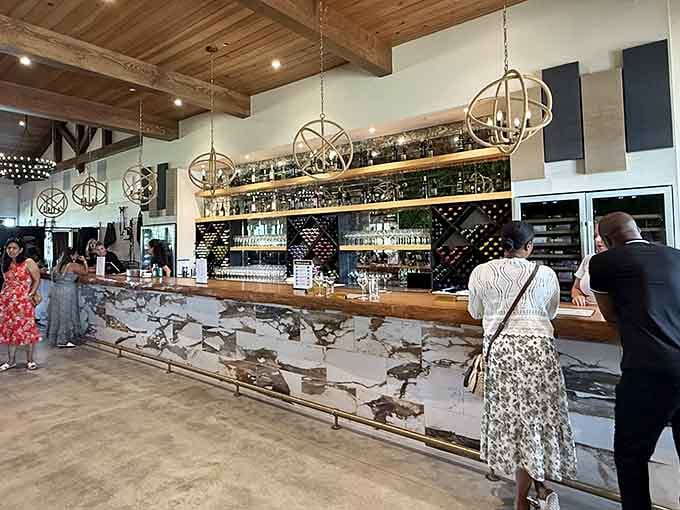 The bar area features rustic wood details and a wine selection that stretches impressively across the back wall&mdash;your liver's Disneyland.