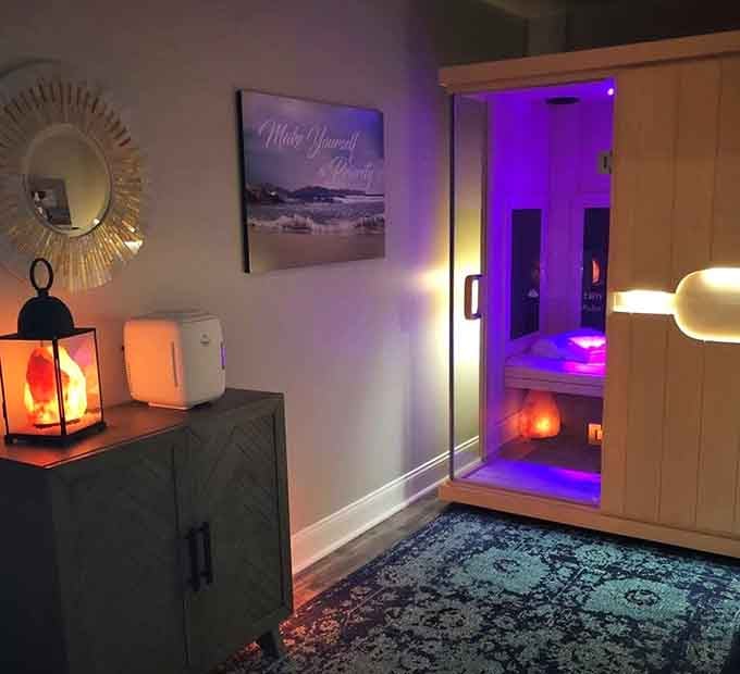 The infrared sauna awaits with purple lighting that screams "spa day" louder than your stress screams.