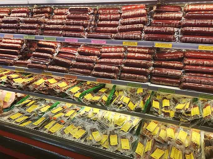 Summer sausages stacked high like delicious logs, each one a testament to Schmidt's commitment to quality craftsmanship.