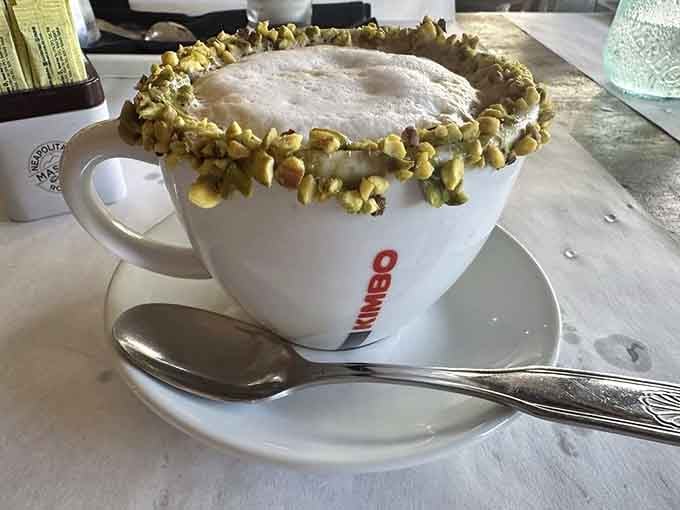 A pistachio-rimmed cappuccino that's almost too pretty to drink, but you absolutely will anyway without hesitation or regret.