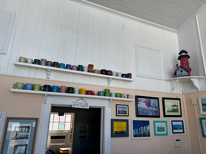 Colorful souvenir mugs line the office walls like a rainbow of past vacations and happy memories collected over time.