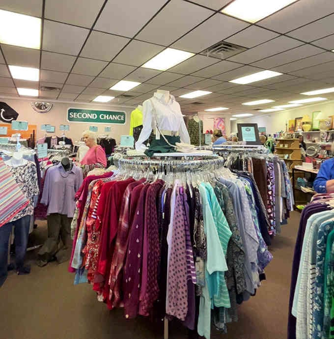 Shoppers browse colorful racks under bright lights, proving that finding deals can be both productive and genuinely enjoyable.