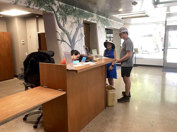 The welcoming desk stands ready to guide your journey through centuries of human ingenuity and resilience.