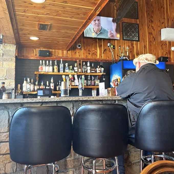 The bar beckons with promises of cold beverages to complement all that smoky, savory goodness.