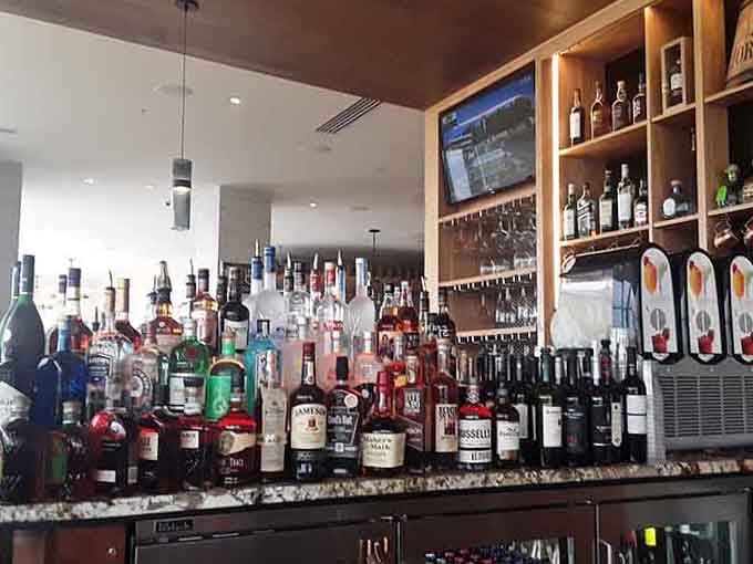 The bar stocks everything from local craft brews to classic cocktails, all served with that lakeside view included.