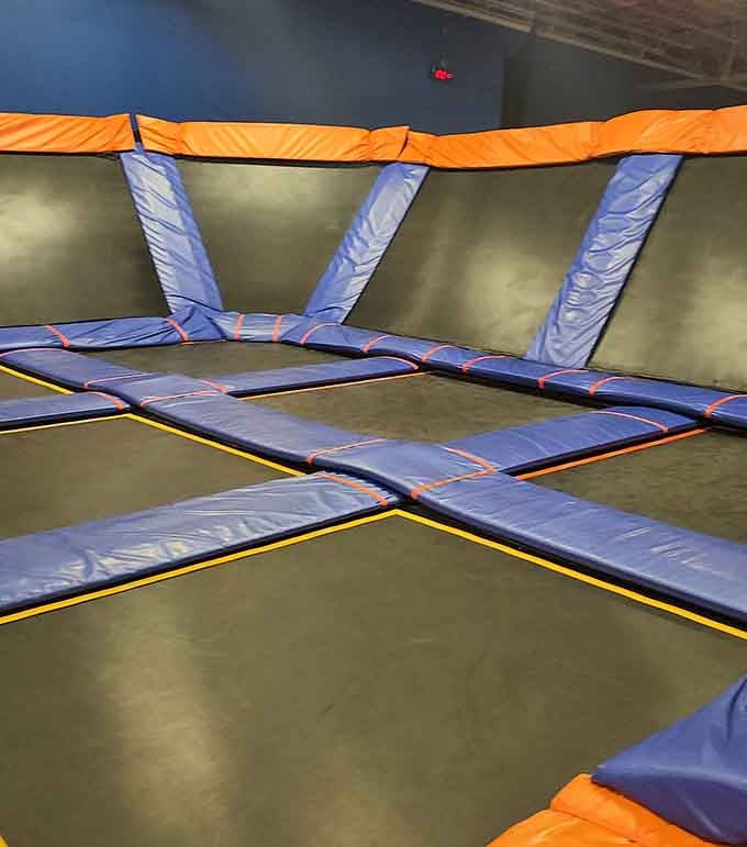 Wall-to-wall trampolines stretch endlessly, proving someone finally understood what childhood dreams were really about all along.