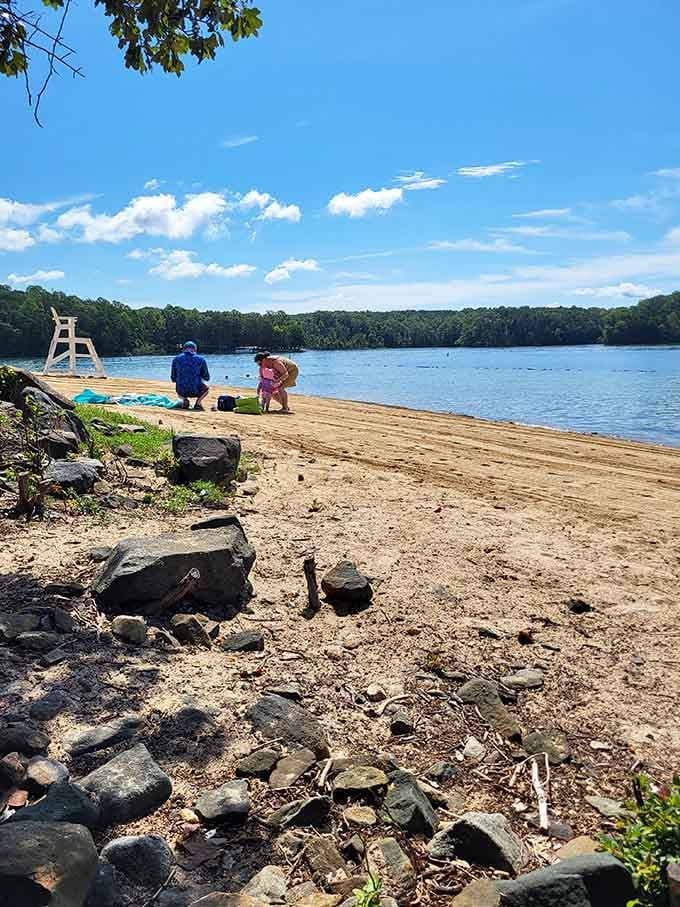 Natural rock formations add character to the shoreline, creating perfect spots for quiet lakeside reflection.