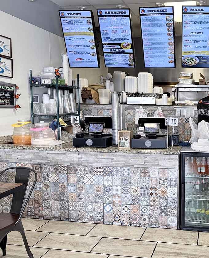 Order at the counter with those colorful tile details, where menu boards promise decisions you'll be happy about.