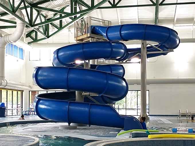 This blue spiral slide twists and turns like it's auditioning for a role in your best summer memories.