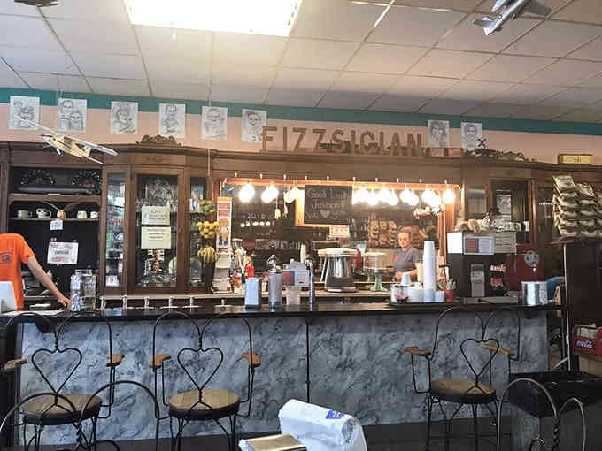 Behind that counter marked "Fizzsician" stands someone ready to prescribe exactly the sweet treat you need today.