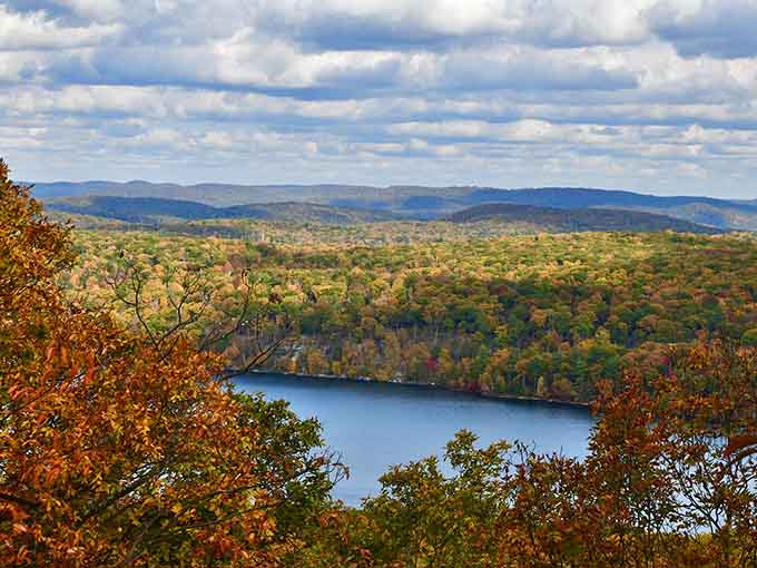 The overlook reveals miles of rolling hills and Sterling Lake below, offering views that make climbing stairs suddenly seem worthwhile.