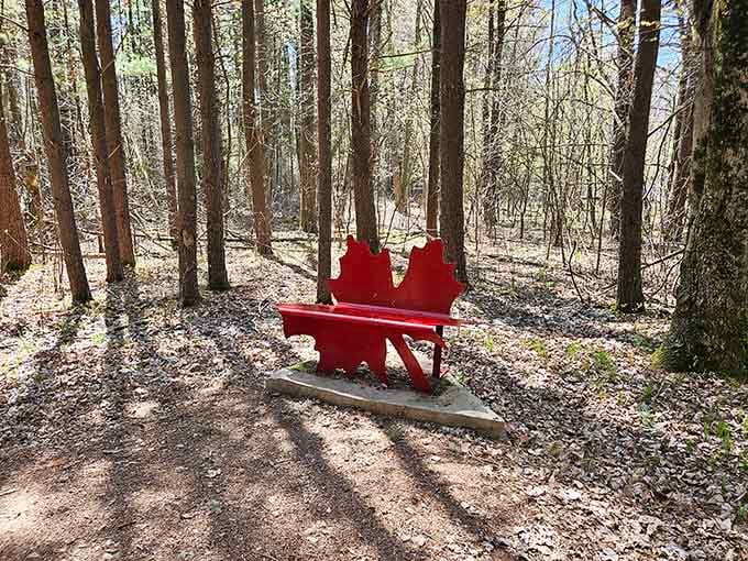 A bright red maple leaf bench invites you to sit and ponder Canada's influence on Wisconsin furniture.