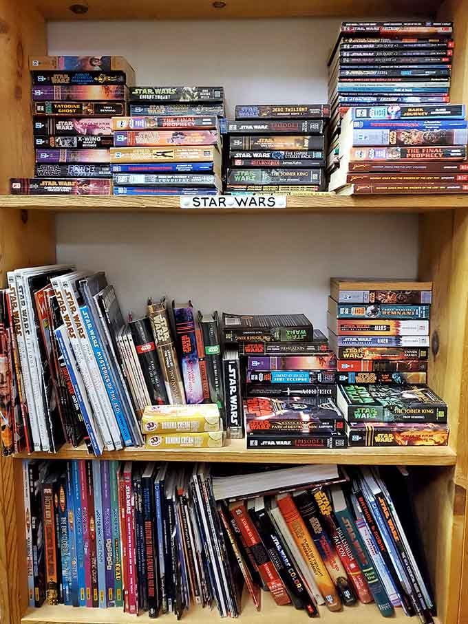The Star Wars expanded universe lives on these shelves, proving that galaxies far away still need physical storage space.
