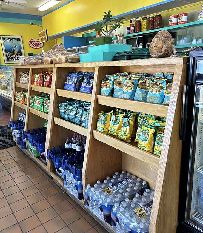 Chips and snacks line the shelves like edible souvenirs waiting to accompany your sandwich home.