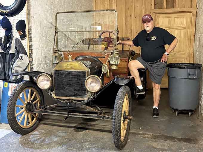 A vintage Ford Model T casually parked inside, because why shouldn't your antique marketplace include actual automotive history too?