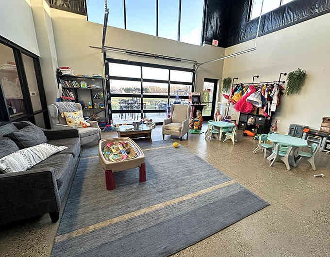 A kids' corner with tiny furniture and dress-up clothes, proving someone here actually remembers what childhood needs.