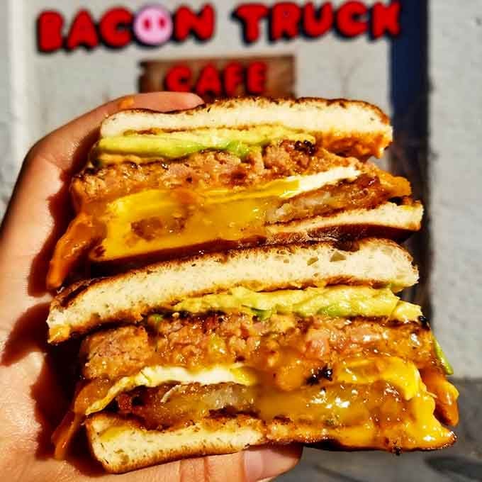 Breaded cutlets stacked high with melted cheese oozing out, this sandwich doesn't whisper, it shouts delicious intentions loudly.