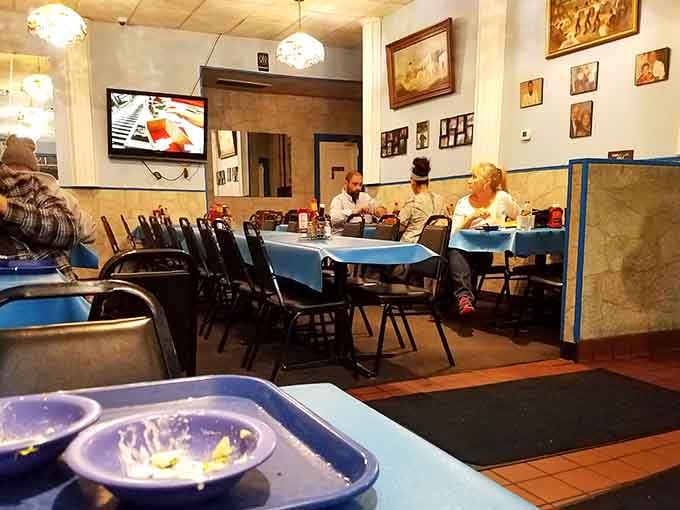 Real people enjoying real meals in a neighborhood spot that's been feeding the community for generations now.