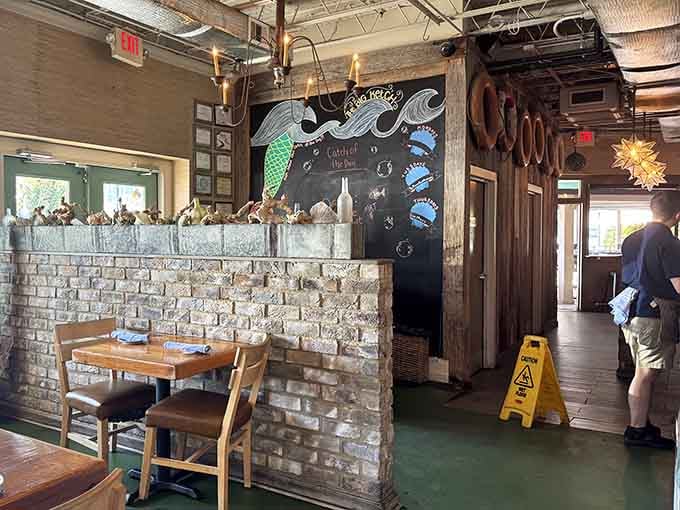 That mermaid chalkboard art adds whimsy to your dining experience without crossing into tacky tourist trap territory here.