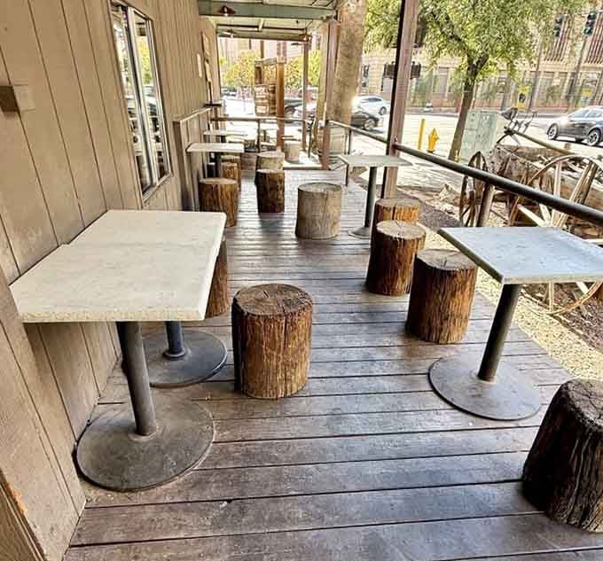 Outdoor seating with tree stump stools, because who needs fancy when you've got character instead?