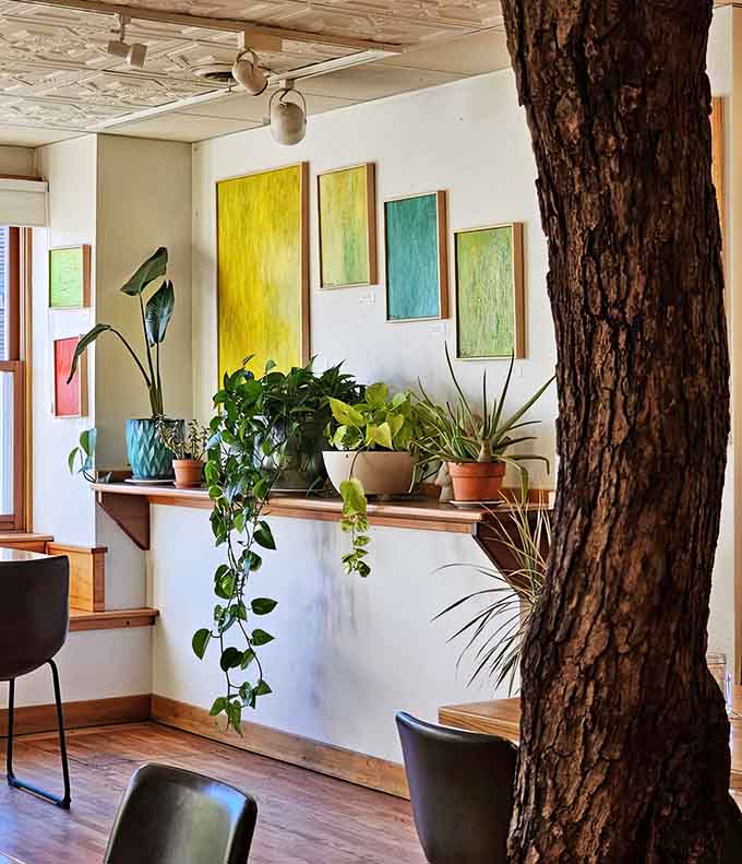 A tree trunk growing right through the dining room because sometimes nature knows best where to put down roots.