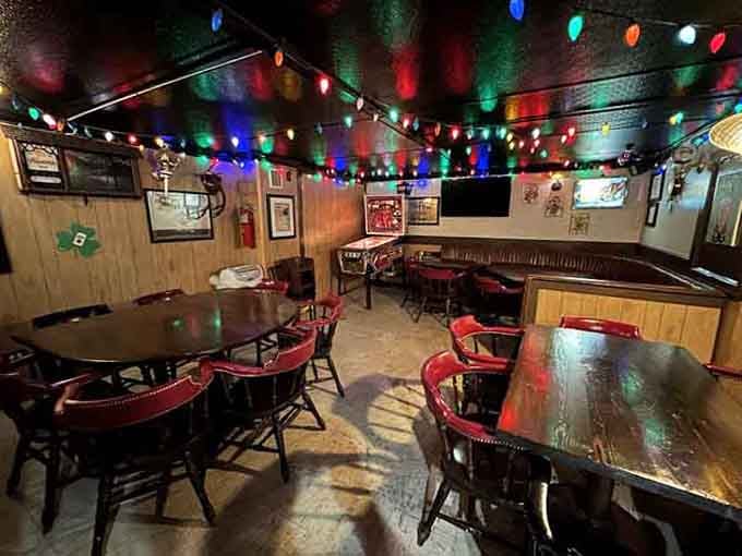 The basement speakeasy glows with colorful lights and vintage charm, creating an atmosphere that makes every night feel like a special occasion.