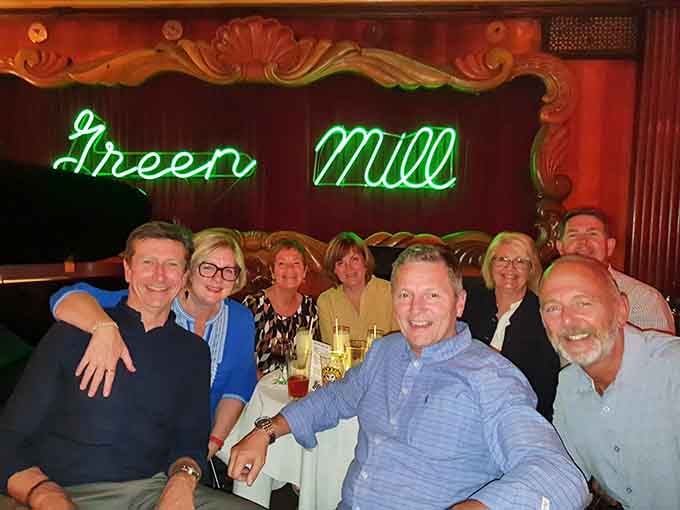 Friends gathered beneath that iconic neon, making new memories in a space built for exactly this moment.
