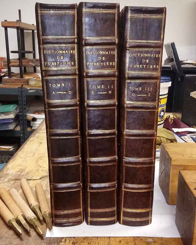 Leather-bound French dictionaries that look like they belong in a castle library, not California.