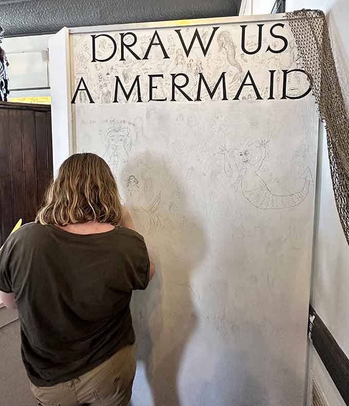 Your artistic skills don't matter here, just grab some chalk and add your mermaid masterpiece to the community collection.